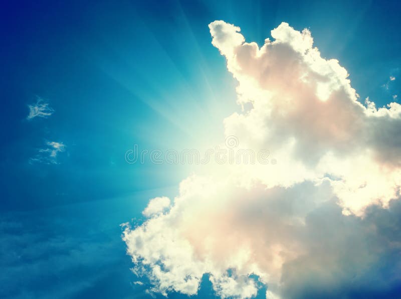 The Sun with Bright Rays in the Blue Sky with White Light Clouds Stock ...