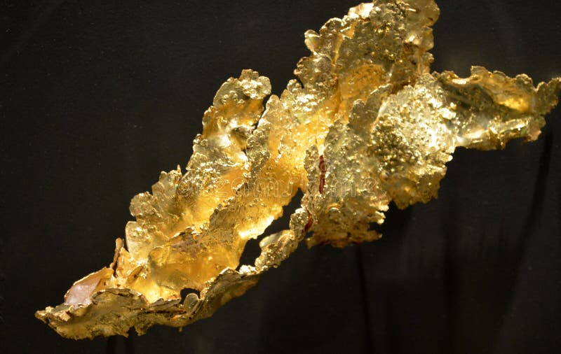 Light Shining Off a Large Gold Flake Stock Photo - Image of flakes ...