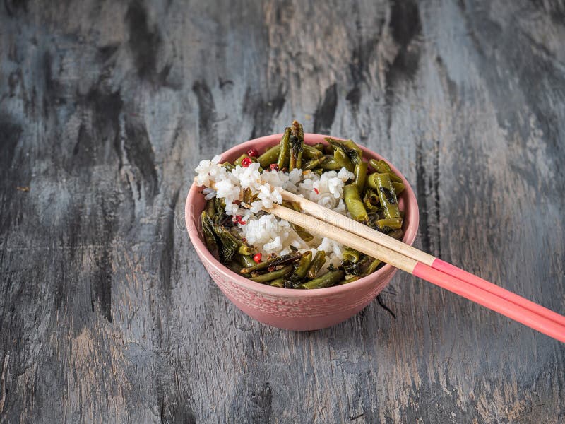 Light Snack with White Rice and String Beans in a Pink Cup with Wooden ...
