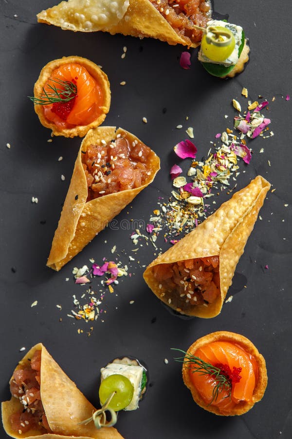 Light Snacks from Rolls, Canapes with Red Fish are on a Plate of Slate ...