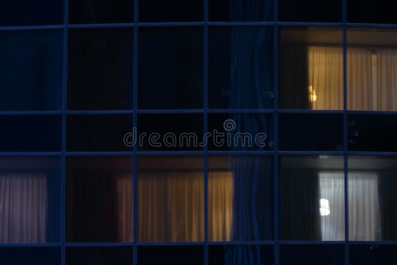 Light in Some Windows at Night. Glass Wall of Modern Building Stock ...
