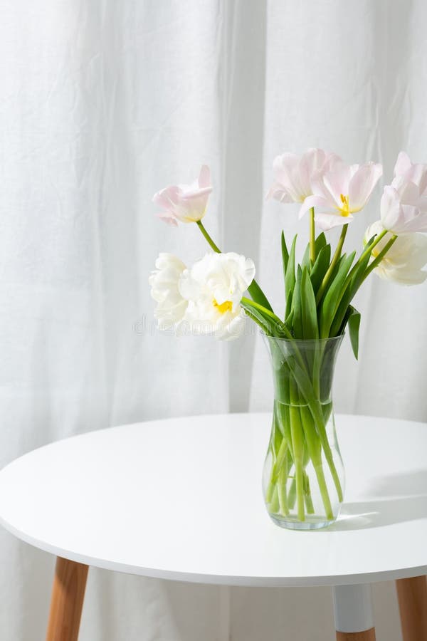 Light Spring Flowers in Vase on White Table Stock Image - Image of home ...