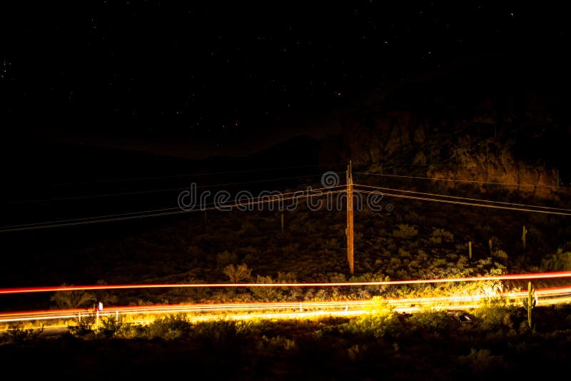 Light Stream of a Vehicle Driving on a Desert Road Stock Photo - Image ...