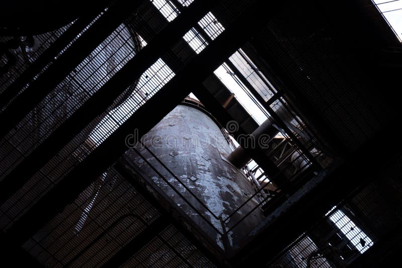 Light Streaming Down into a Dark Industrial Structure through Grates ...