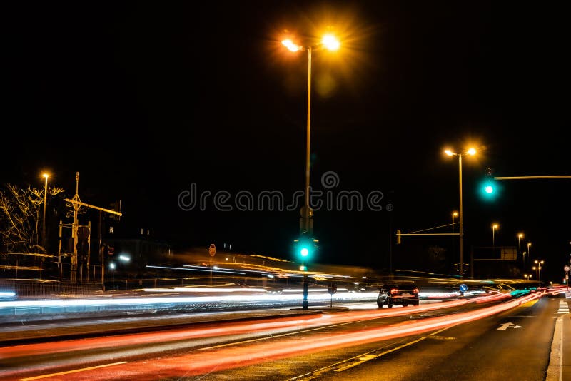 Light Stripes of Cars Driving Over an Intersection at Night Stock Image ...