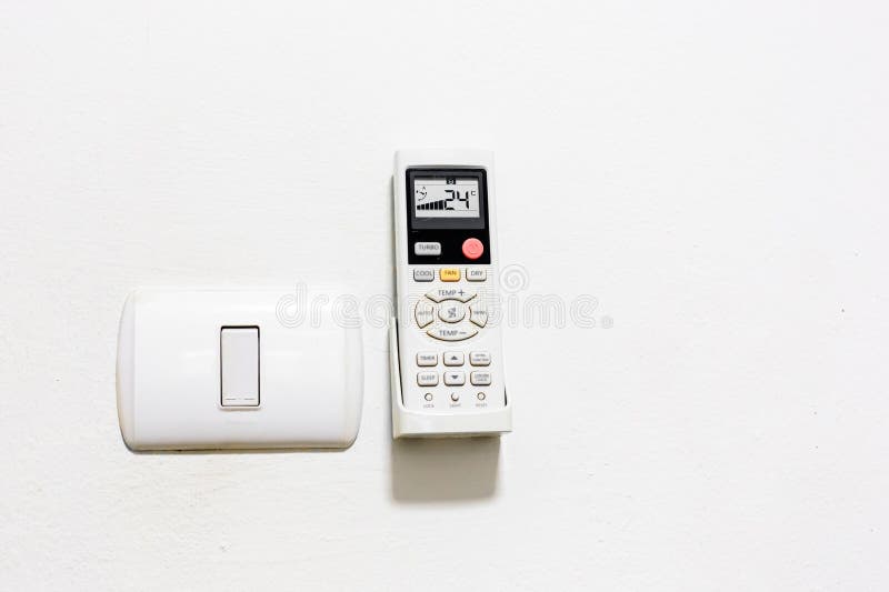 Light Switch and Air Conditioner Remote Control on White Wall, Copy ...