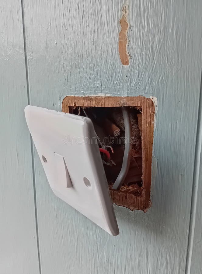 Light Switch Hanging Off Wall Showing Exposed Wiring Behind it Stock ...