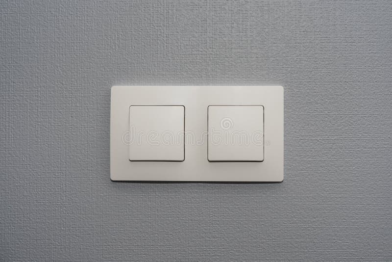 A Light Switch, a Plastic Mechanical Switch of White Color Installed on ...