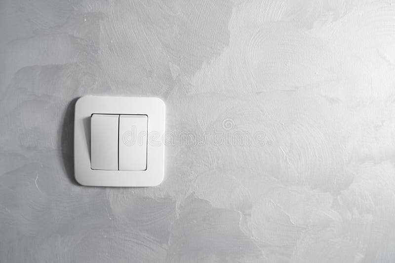 Light Switch. Plastic Mechanical Switch of White Color Installed on a ...