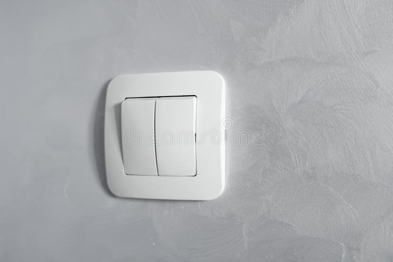 Light Switch, a Plastic Mechanical Switch of White Color Installed on a ...