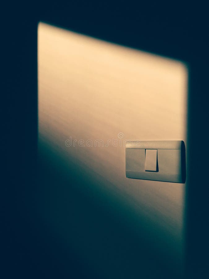 Light Switch and Square Shadow Reflection on the Wall Stock Photo ...