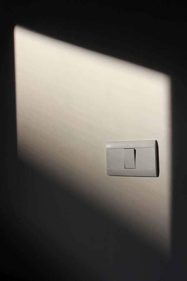 Light Switch and Square Shadow Reflection on the Wall Stock Image ...