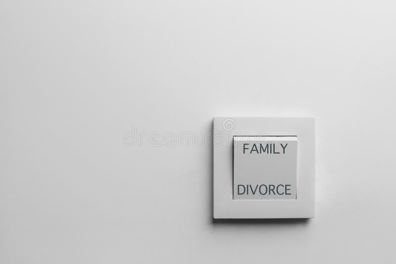Light Switch with Words Family and Divorce on White Wall, Space for ...
