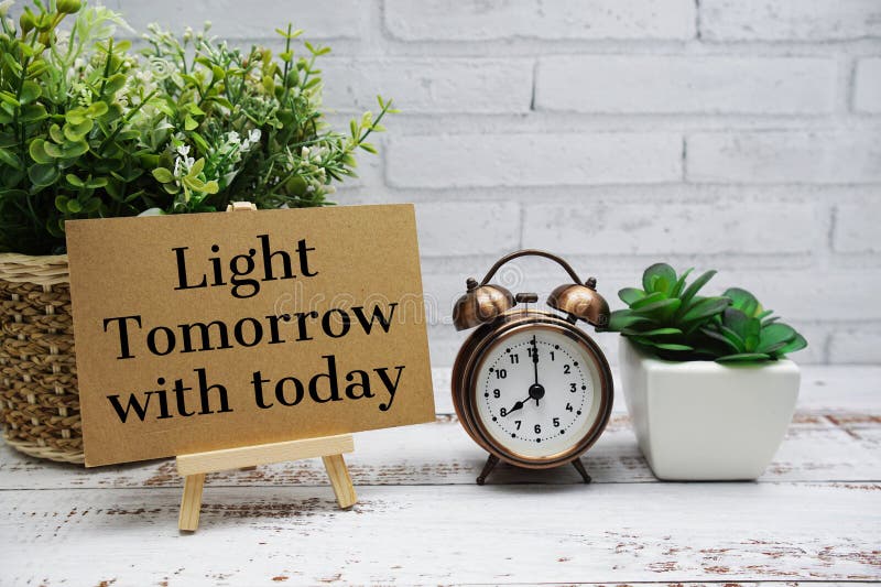 Light Tomorrow with Today Text Message with Easel Stand on Wooden ...