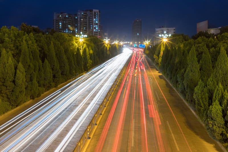 Light trails on city road stock image. Image of blurred - 130043121