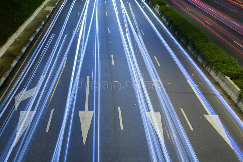 Light Trails Over Traffic Signs at Night Stock Photo - Image of arrows ...