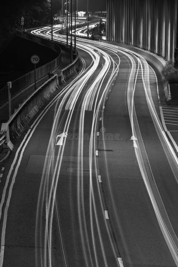 Light Trails of Traffic on Road at Night. Transportation Background in ...