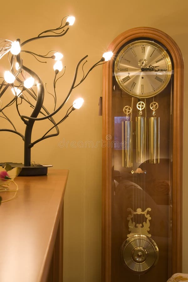 Light Tree on Shelf and Clock Stock Image - Image of closeup, pendulum ...