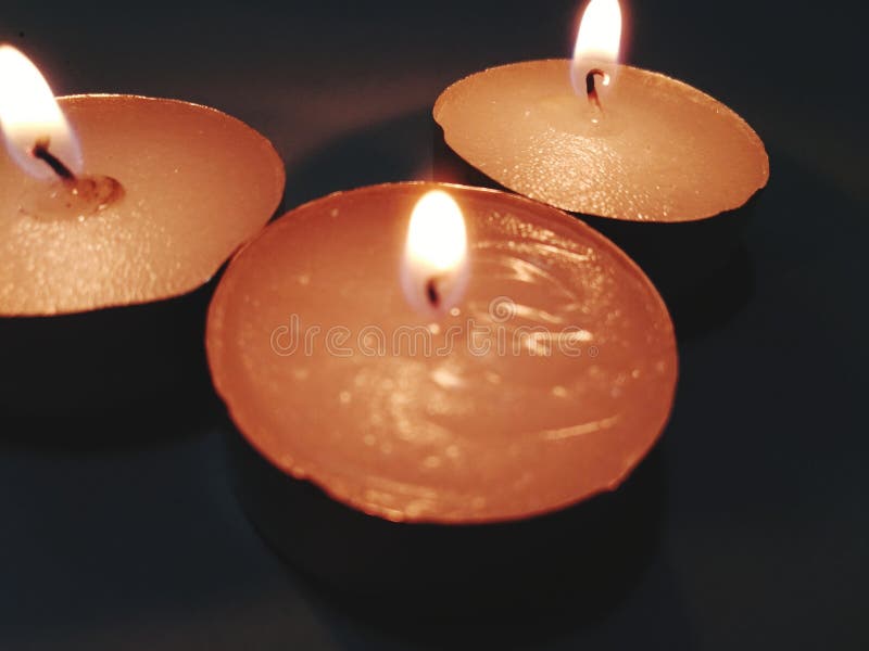 Light Up a Fire in a Candle and See the Lights in the Dark Night Stock ...