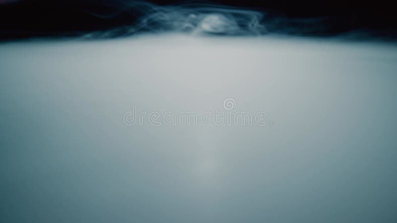 White Smoke Spreads Along Dark Surface and Blows Away Stock Video ...