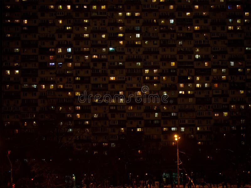 Light in the Windows of an Apartment Building at Night Stock Photo ...
