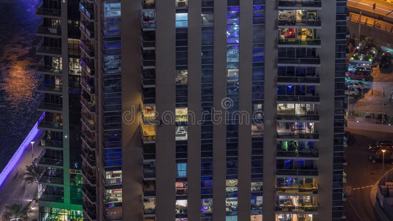 Light in Windows of Modern Towers. Exterior of Apartment Building at ...