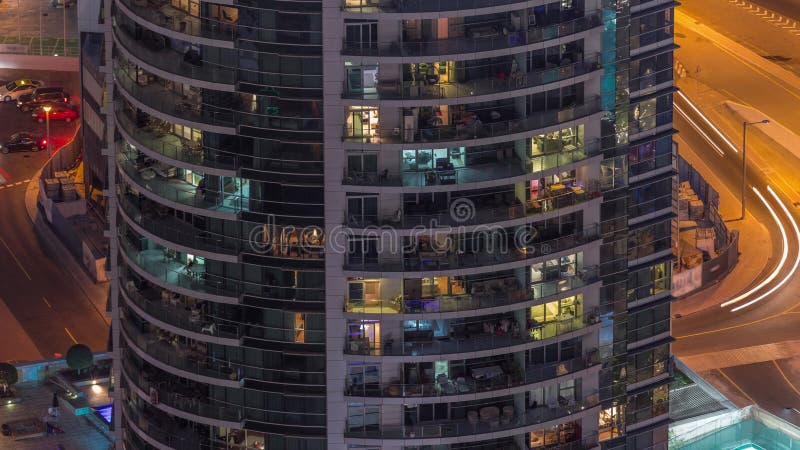 Light in Windows of Modern Towers. Exterior of Apartment Building at ...