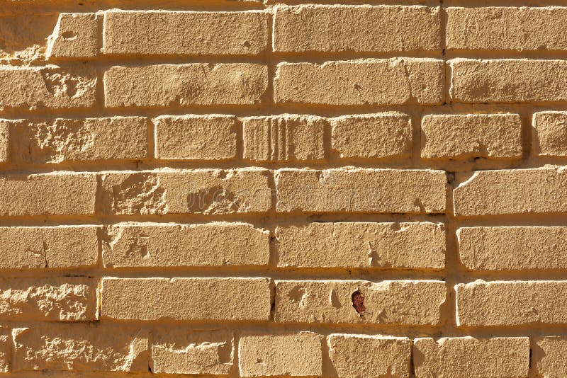 Light yellow brick wall stock image. Image of urban, wall - 73640427