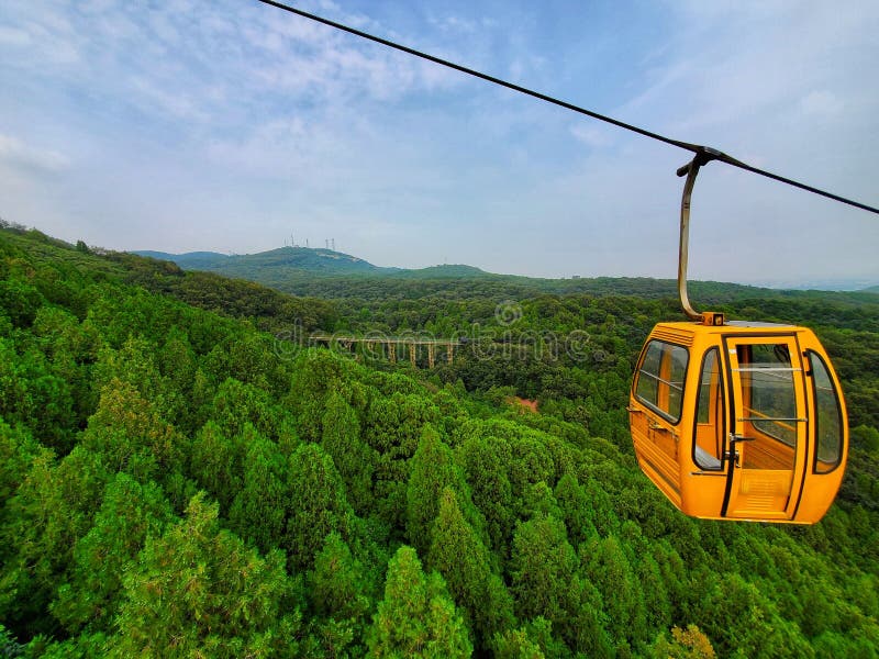 Light Yellow Cable Car Above Green Mountains Stock Image - Image of ...