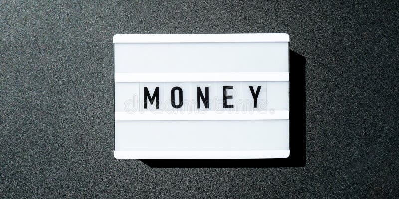 Lightbox Board on a Black Background with the Words MONEY in Black ...