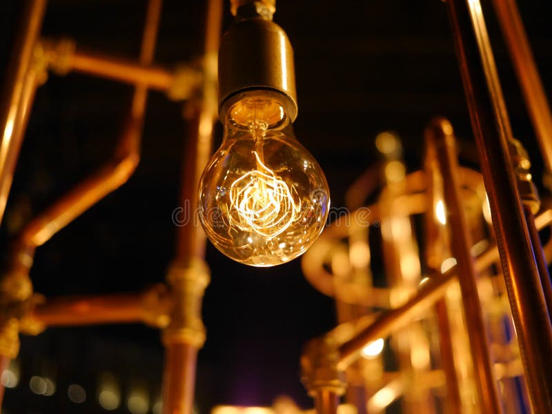 Lightbulb with Copper Pipes Stock Photo - Image of bulb, wire: 83919906