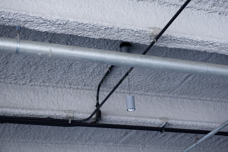 Lightbulb Hanging on Wire, Cord, Cable on Cement Rough Ceiling in ...