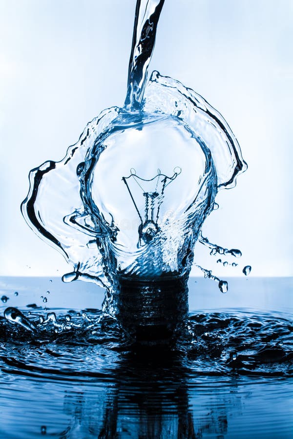 Lightbulb Splashed with Water on Dark Surface with Blue Hue Stock Image ...
