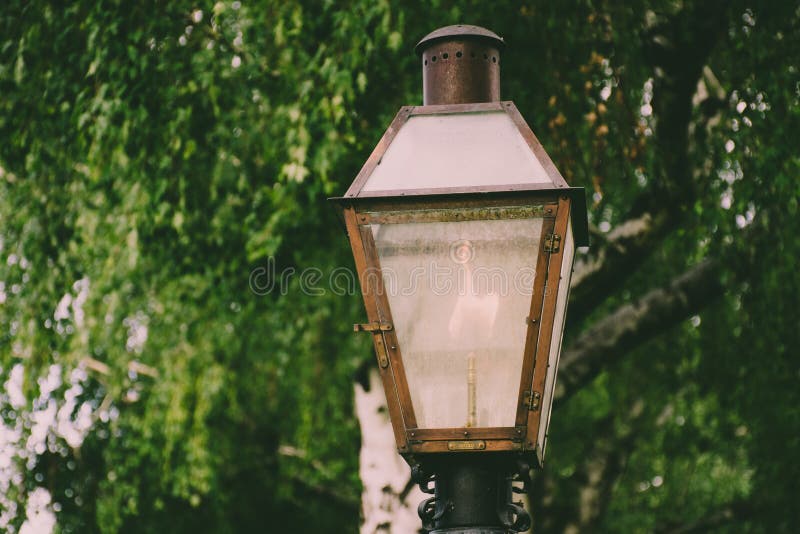 Lighted Brown Metal Post Lamp Stock Photo - Image of lantern ...