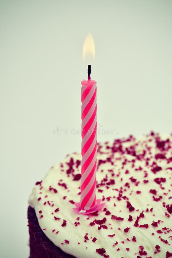 Lighted Candle on a Cake, Vignetted Stock Image - Image of lighted ...
