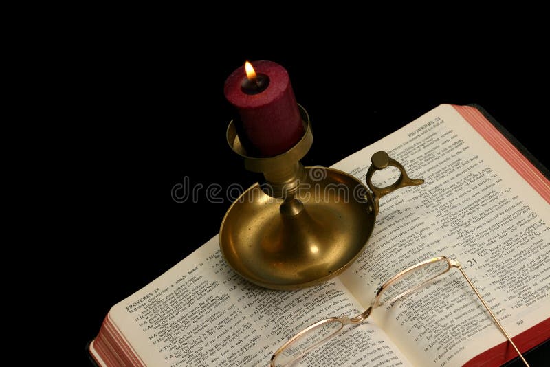Lighted Candle on Open Bible Stock Photo - Image of religious ...