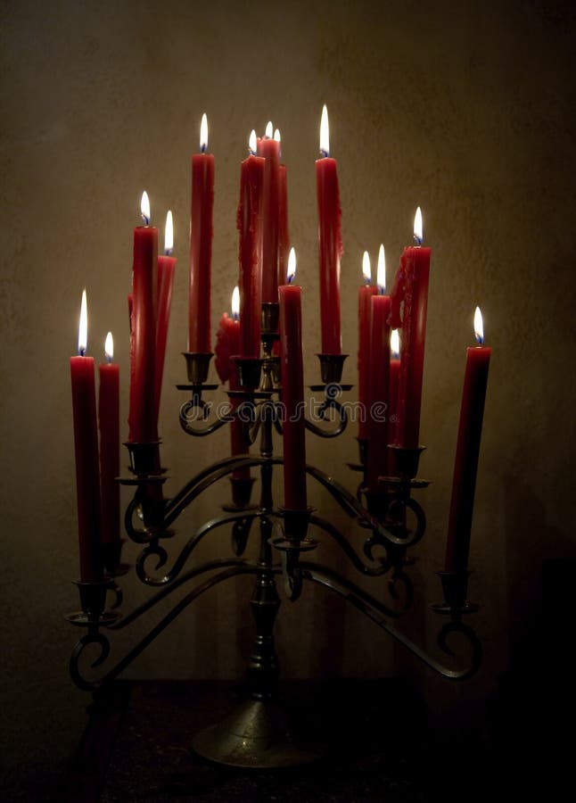 Lighted Candles on Iron Candlestick Stock Photo - Image of black ...