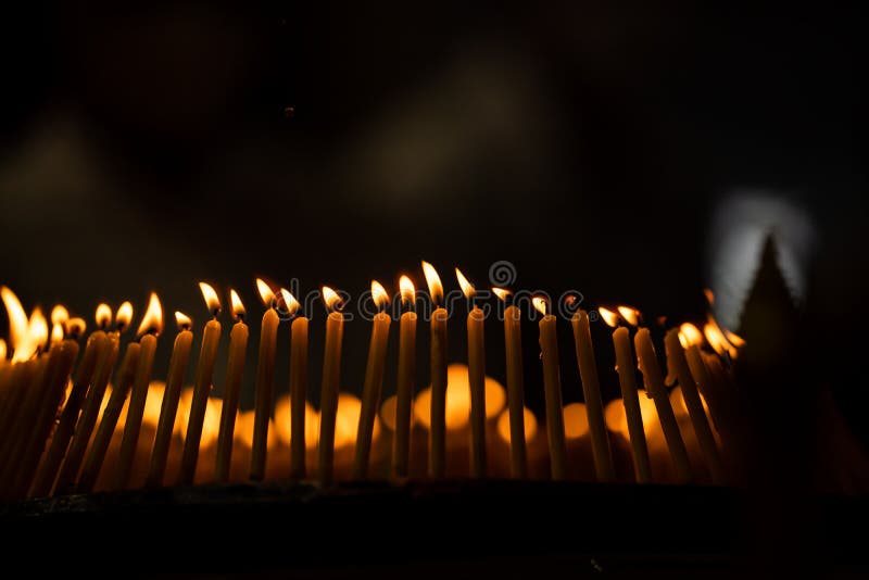 Lighted Candles Laid Out in Circle in the Dark with Small White Shadow ...
