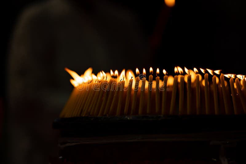 Lighted Candles Laid Out in Circle in the Dark with Small White Shadow ...