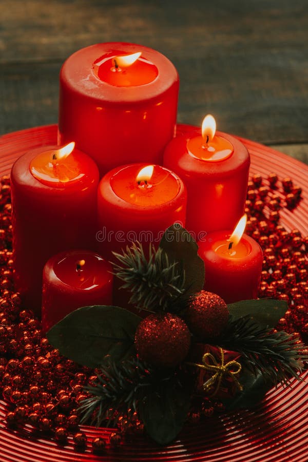 Lighted Candles with Red Colored Pearls Around Stock Photo - Image of ...