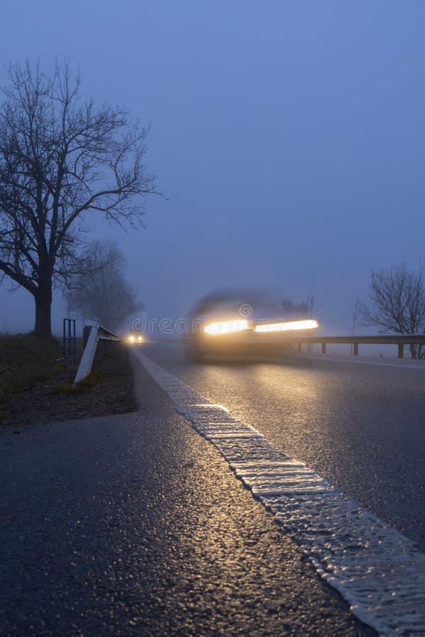 Lighted Cars at Dusk on Main Road Stock Photo - Image of drive, sundown ...