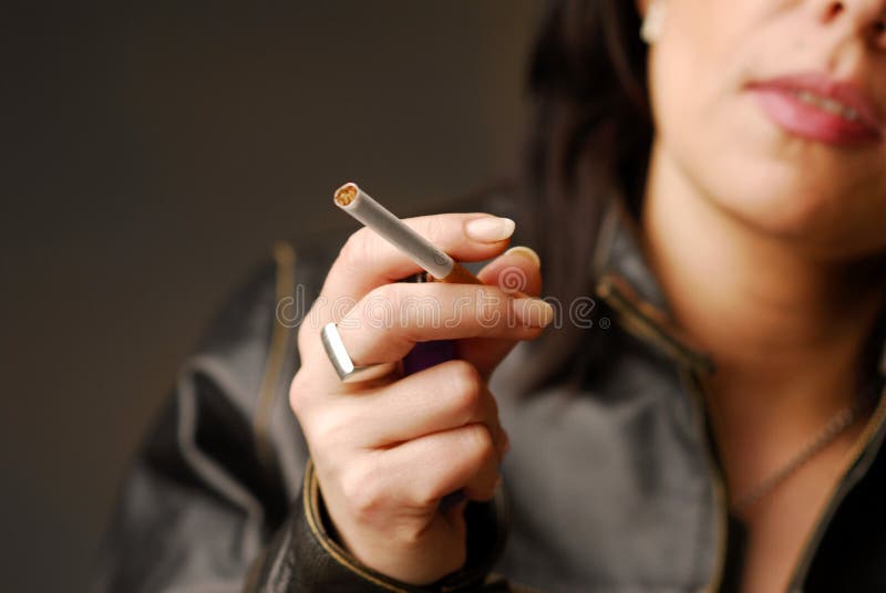 A lighted cigarette stock image. Image of cigarette, revel - 4016233