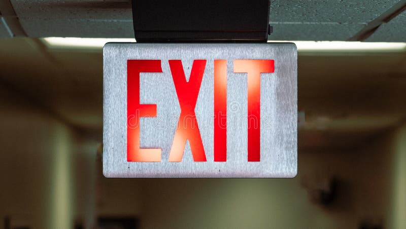 Lighted Emergency Exit Sign Stock Photo - Image of black, closeup ...