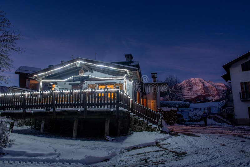 Lighted house at sunset stock image. Image of apres - 135108483