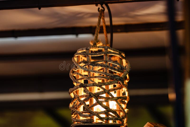 A Lighted Lantern Hanging from a Rope Stock Photo - Image of interior ...