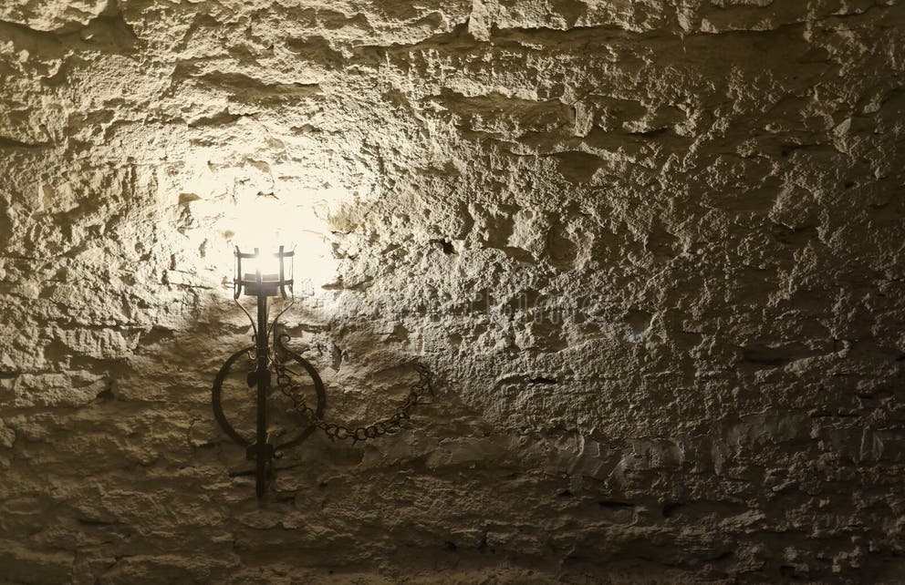 Lighted Medieval Castle Torch Hanging on a Stone Wall, Vintage Objects ...
