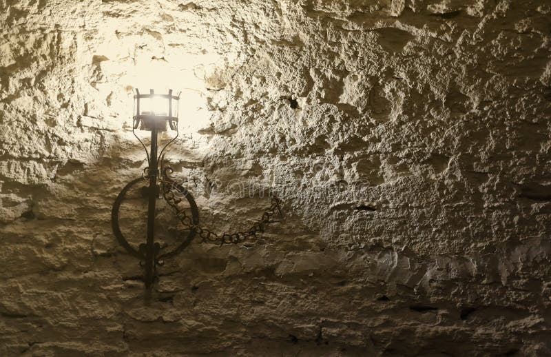 Lighted Medieval Castle Torch Hanging on a Stone Wall, Vintage Objects ...