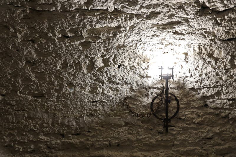 Lighted Medieval Castle Torch Hanging on a Stone Wall, Vintage Objects ...