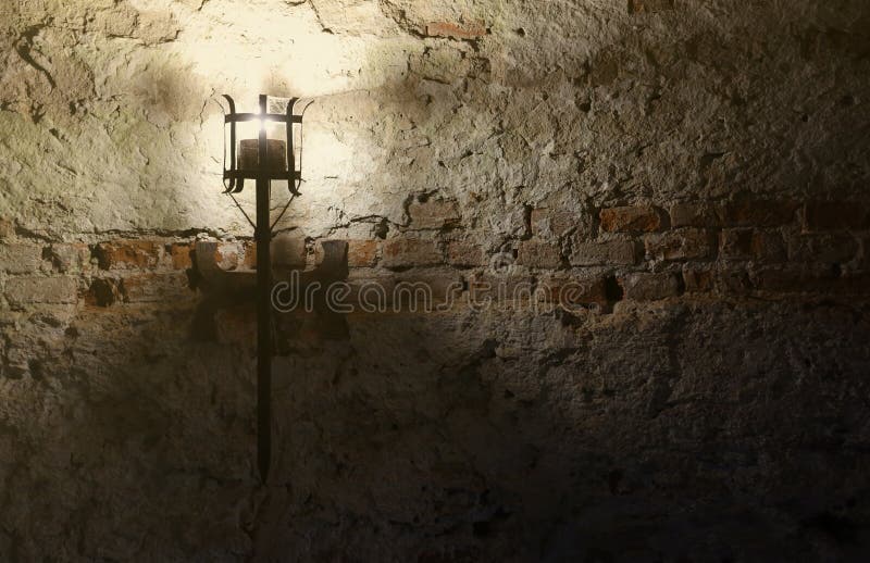 Lighted Medieval Castle Torch Hanging on a Stone Wall, Vintage Objects ...