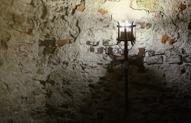 Lighted Medieval Castle Torch Hanging on a Stone Wall, Vintage Objects ...